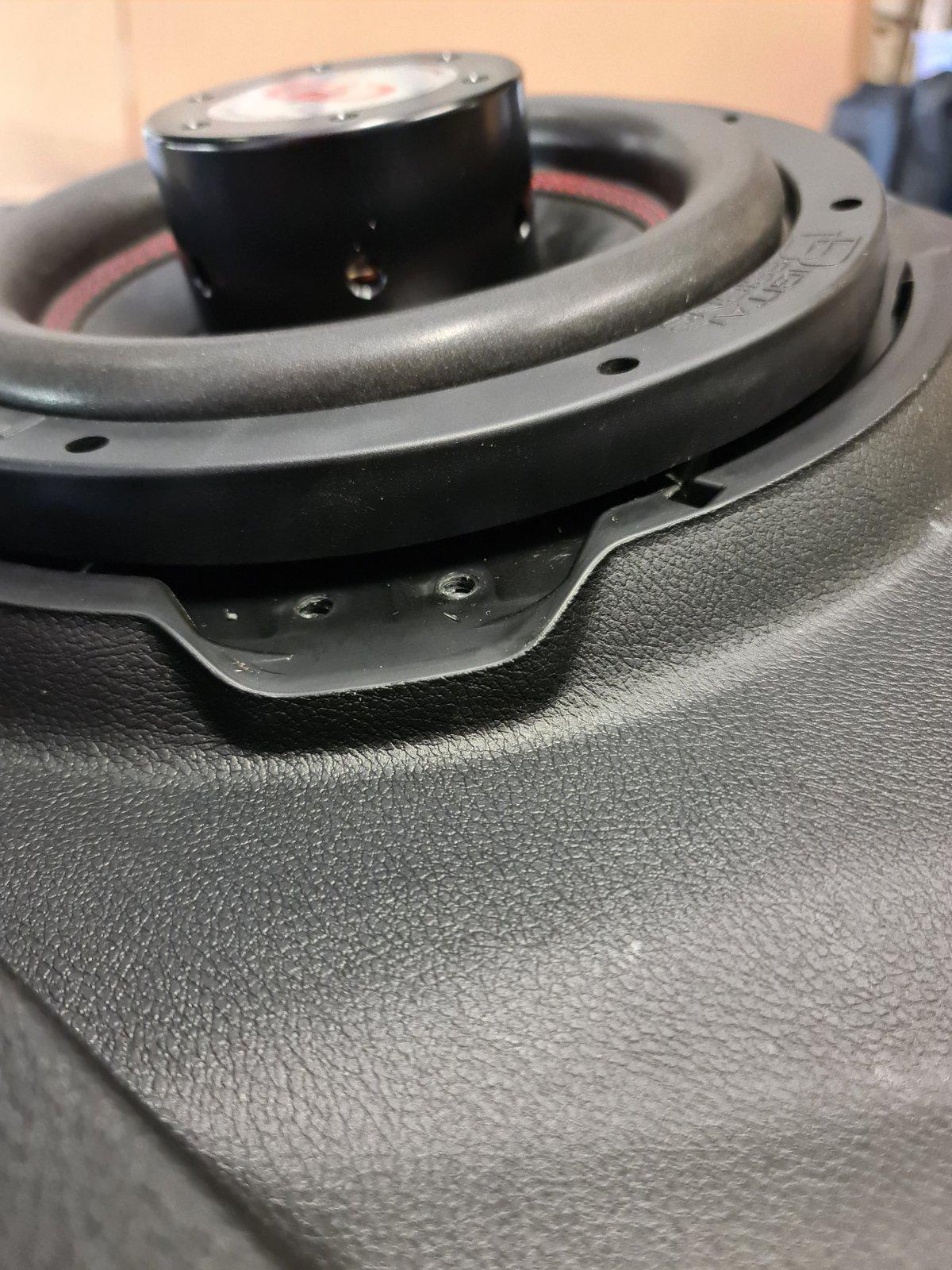 Has anyone put a better subwoofer in the factory alpine enclosure ...